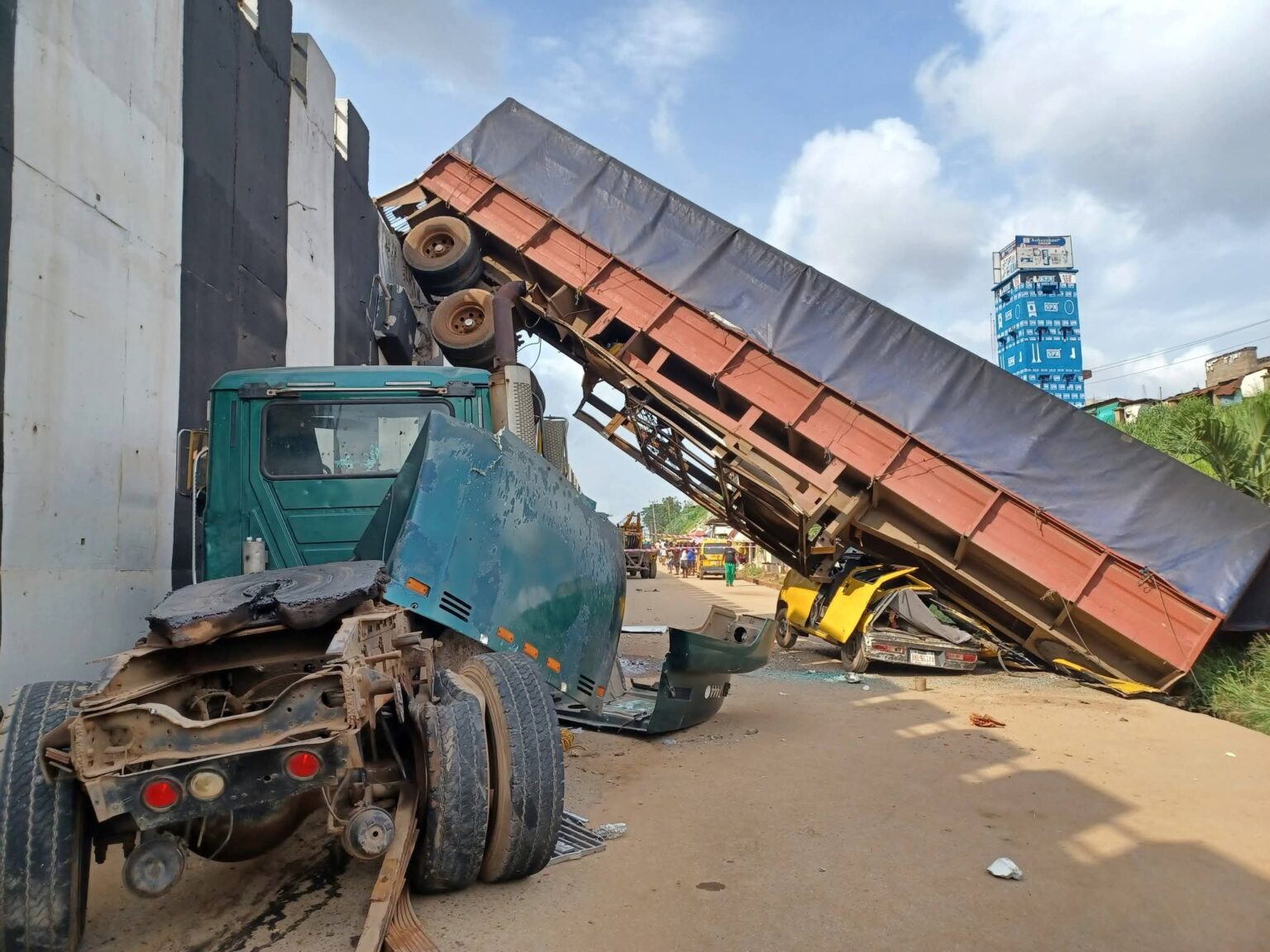 No Life Lost As Heavy-Duty Vehicle Falls Off Tarzan Flyover In Nkpor ...